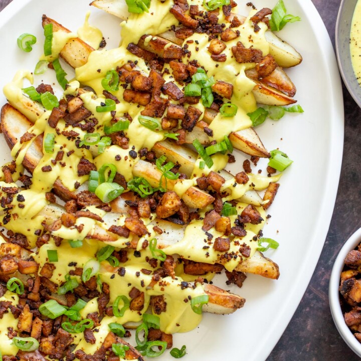 Loaded Vegan Baked Potato Wedges with Cheese Sauce & Vegan Bacon