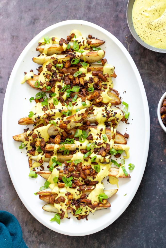 Loaded Vegan Baked Potato Wedges with Cheese Sauce & Vegan Bacon